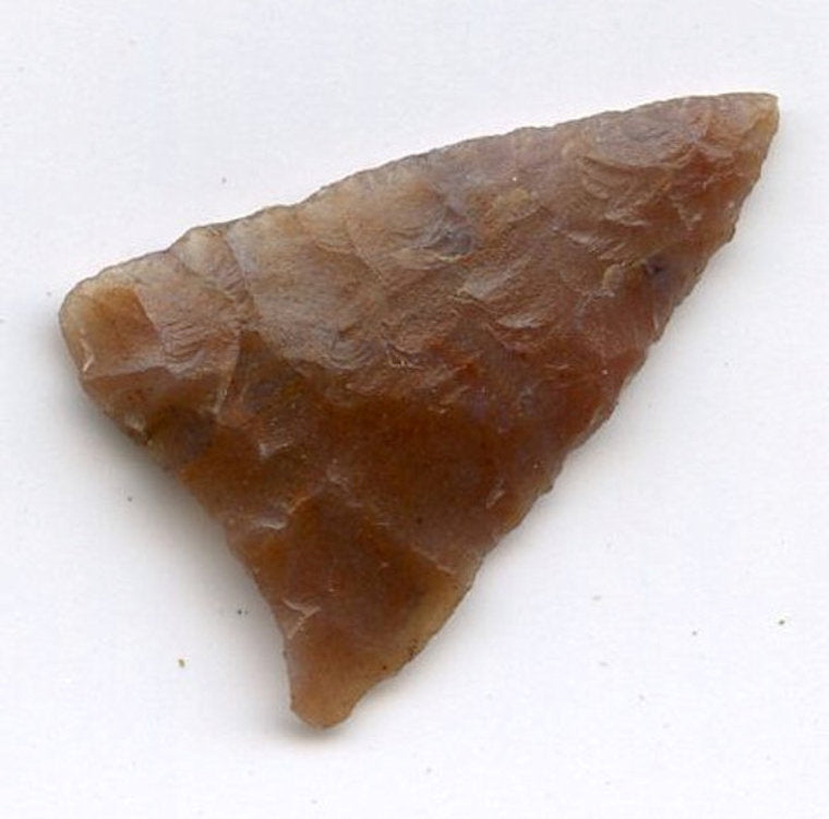 Agate shallow concave base triangle point, North Africa, late Neolithi ...